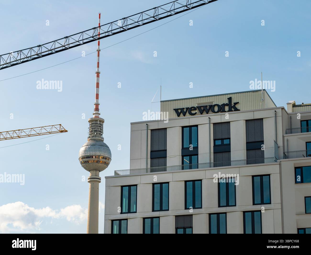 WeWork logo sign on an office building with the TV Tower landmark in ...