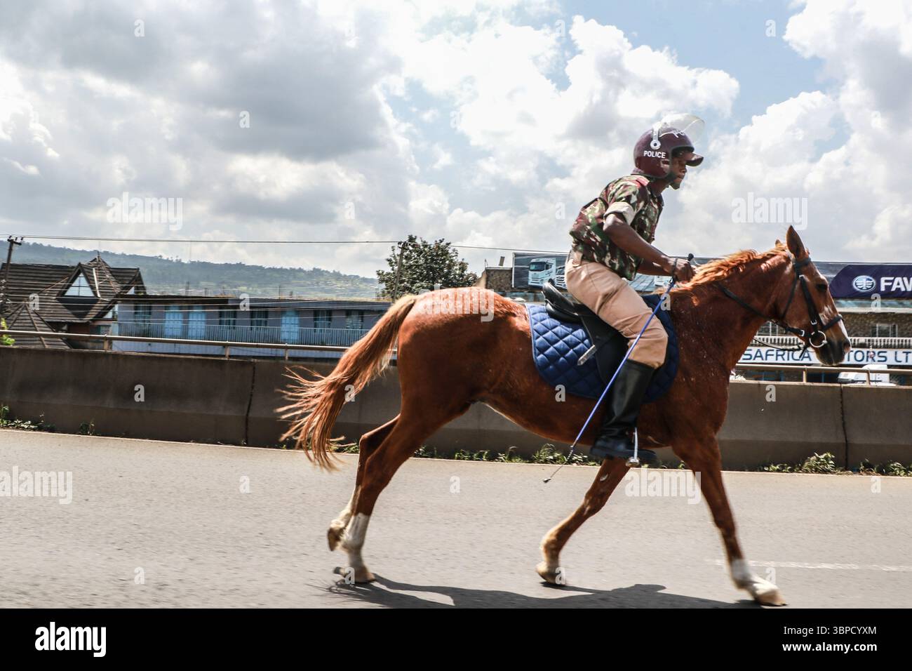 A police officer on horseback patrols the streets during the Saba Saba ...