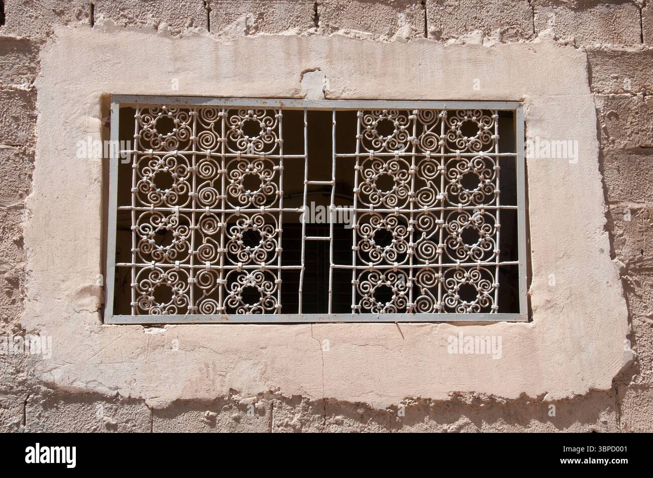 Decorative window grill of an historic adobe building in Erfoud ...