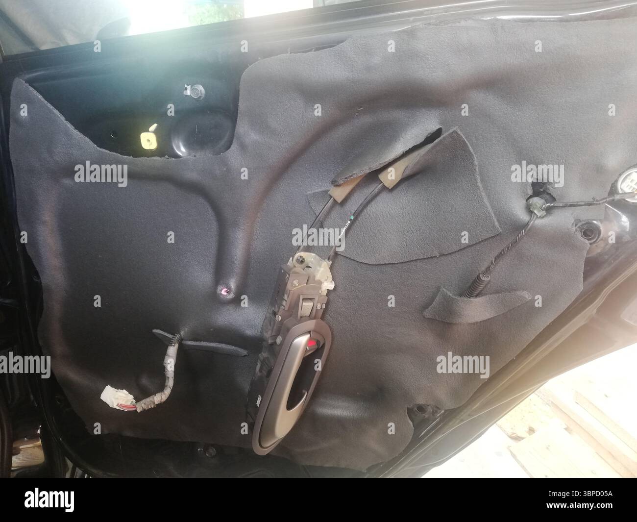 Car soundproofing installation using butyl sheets, foam, and acoustic ...