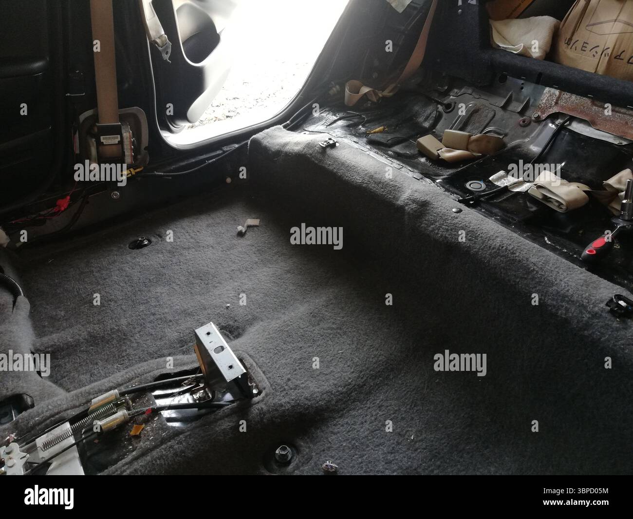 Car soundproofing installation using butyl sheets, foam, and acoustic ...