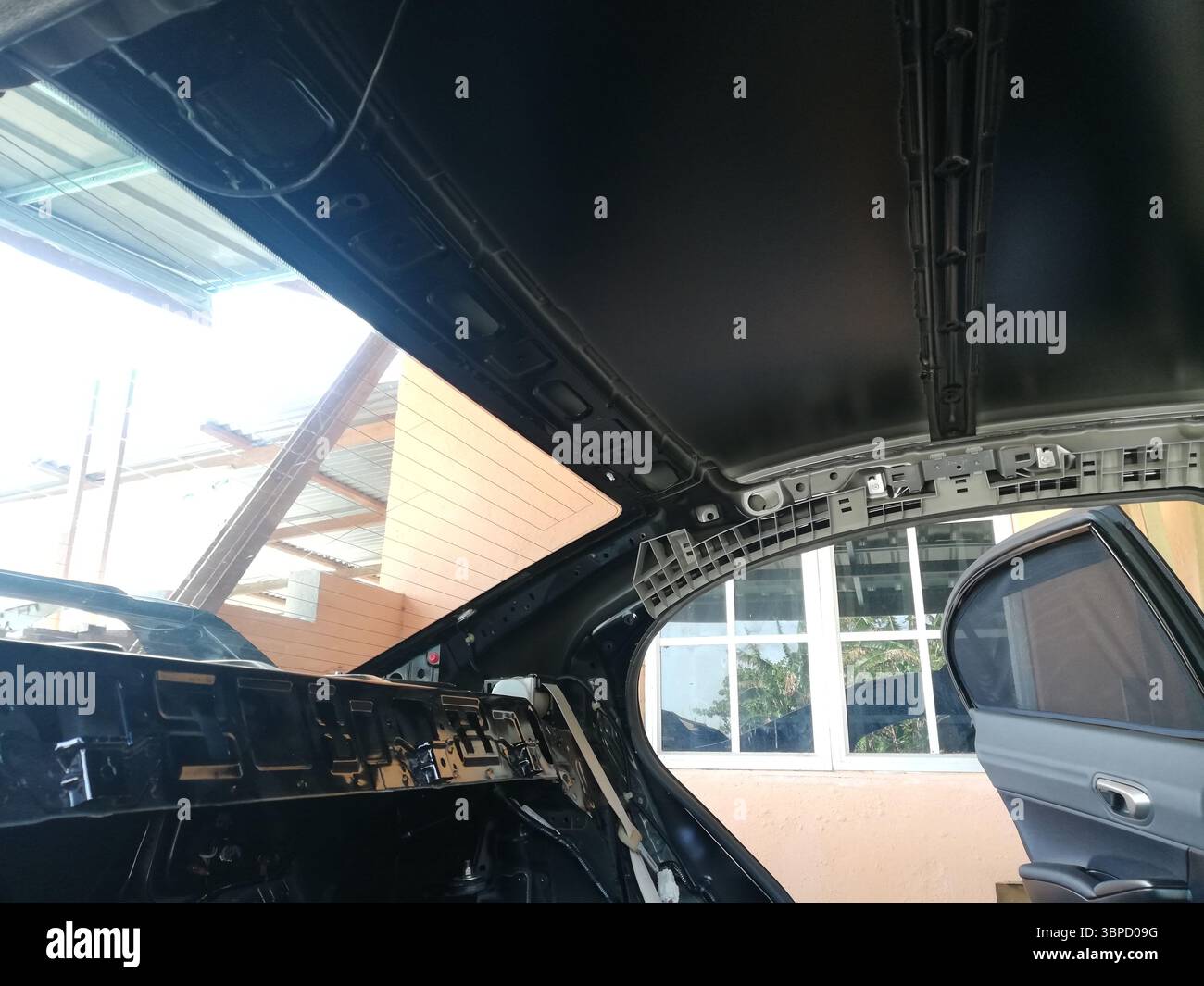 Car soundproofing installation using butyl sheets, foam, and acoustic ...