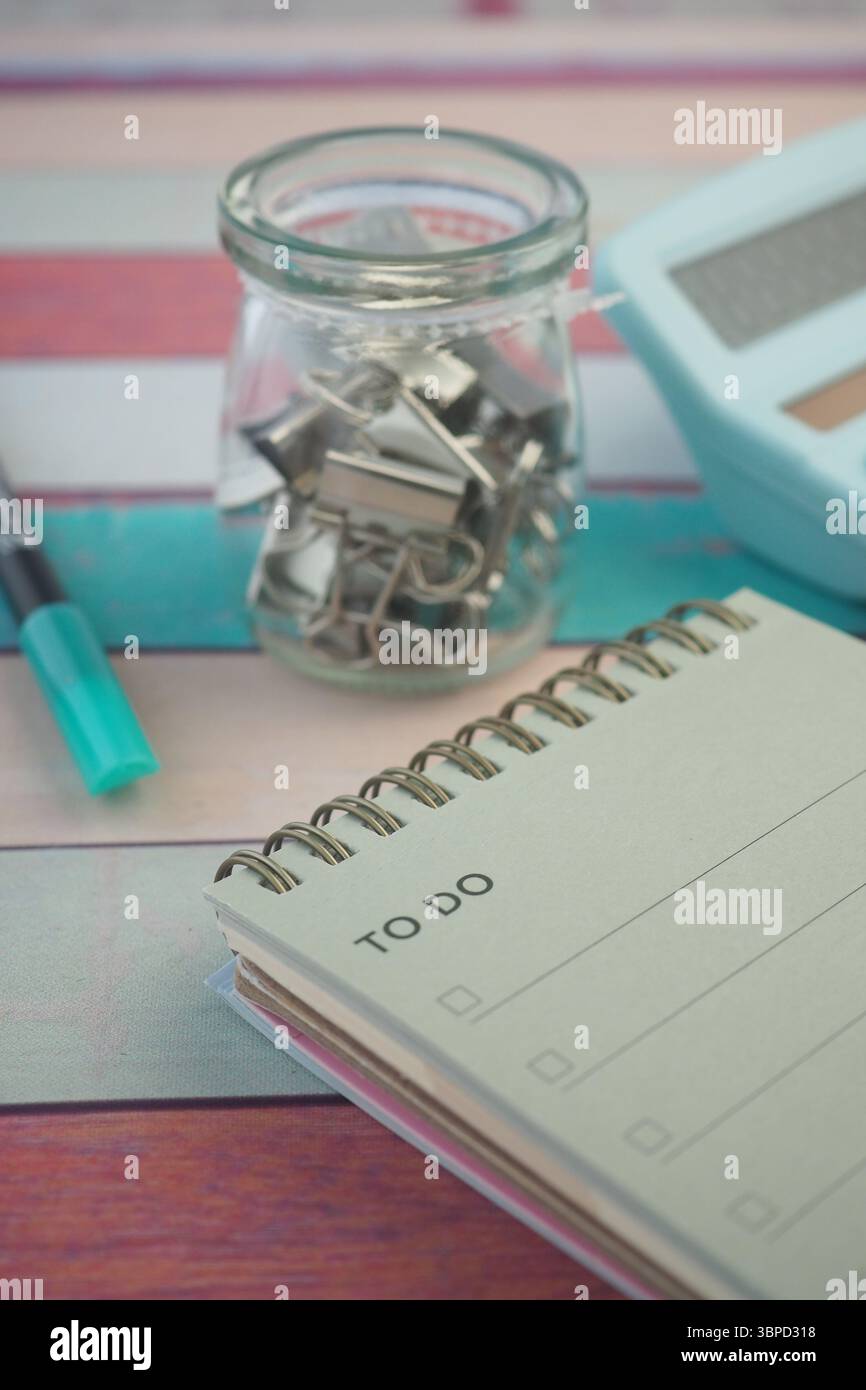 Organizing tasks with a to-do list and stationery essentials Stock ...