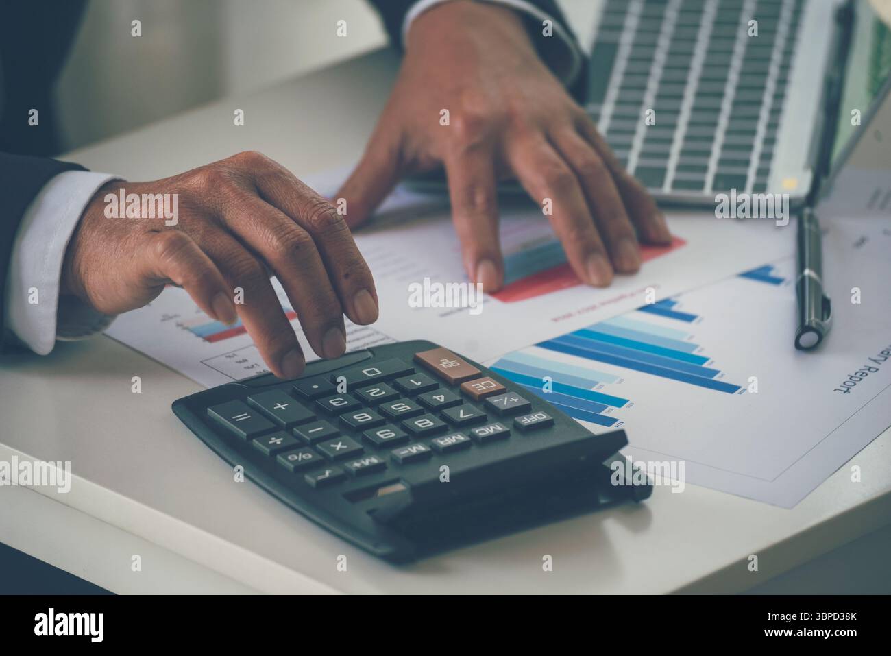 Close up business man hands using calculator counting tax financial bill. Man hands calculating ...