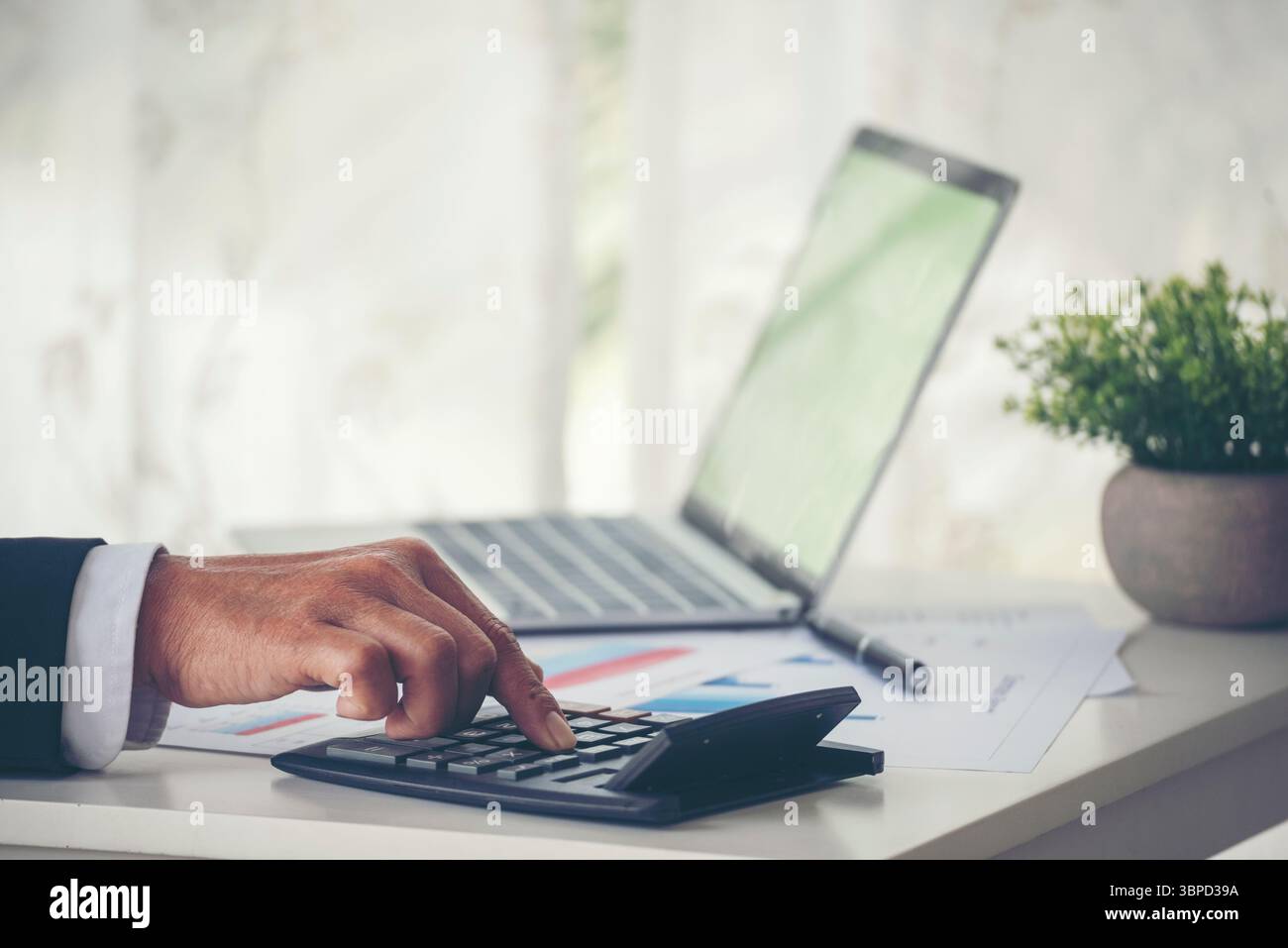 Close up Man hands calculating number, data, graph, chart audit ...