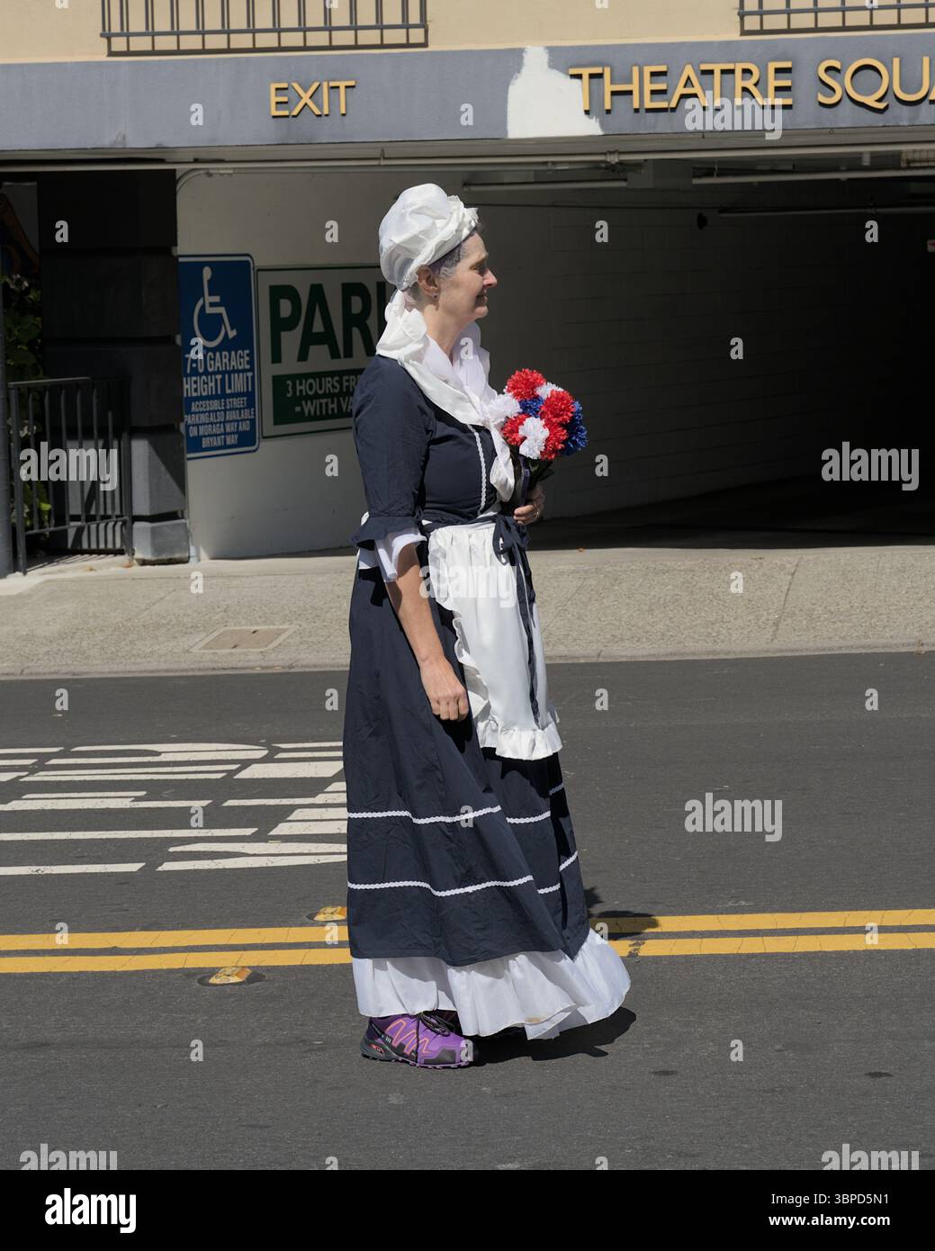 Orinda 4th of July Parade: A woman walks down the street while wearing ...
