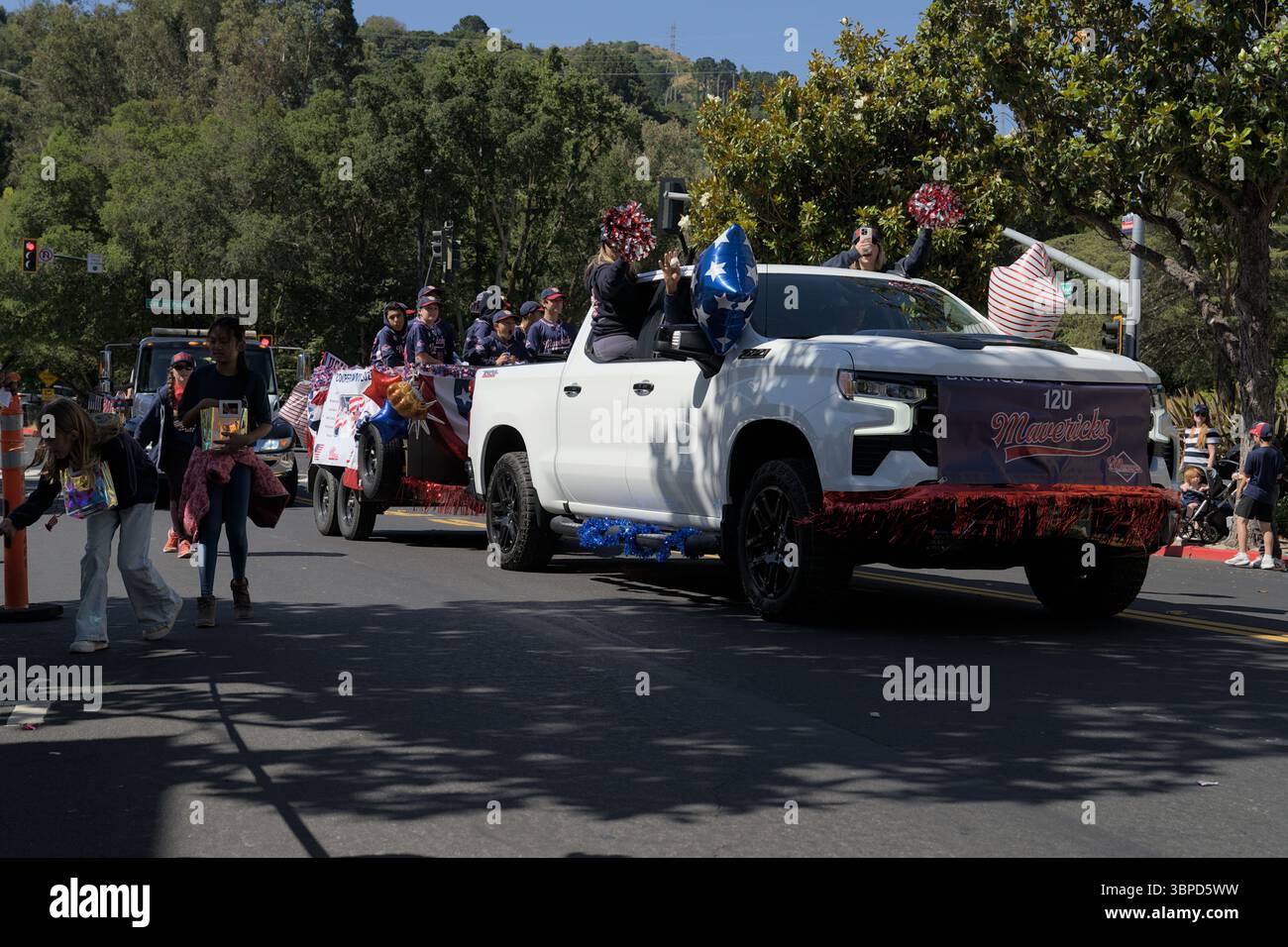 Orinda 4th of July Parade: Young baseball players ride in a trailer ...
