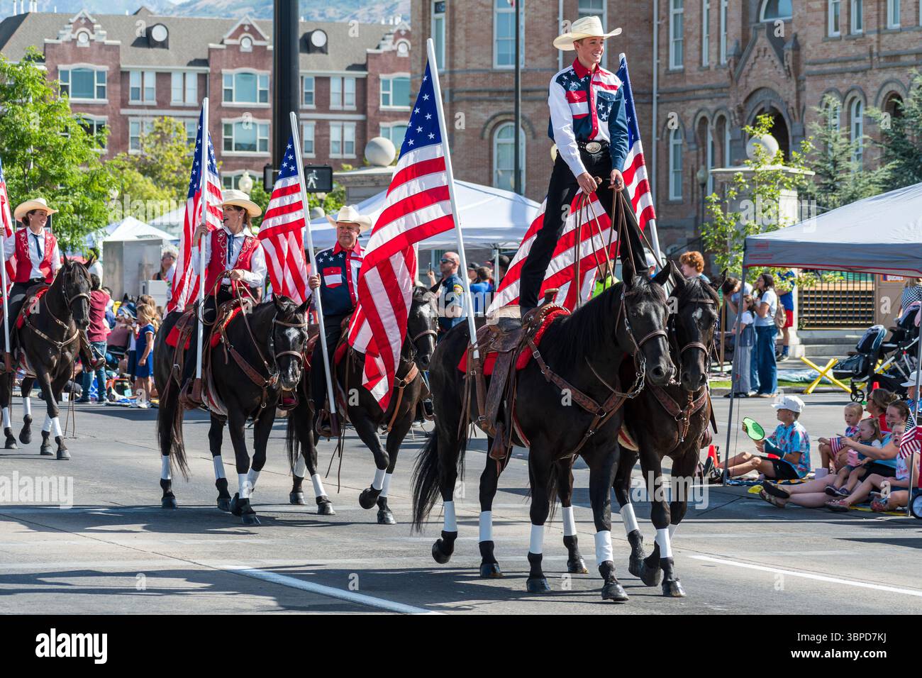 Provo, Utah – July 4, 2025: Western equestrian riders carry U.S. flags ...