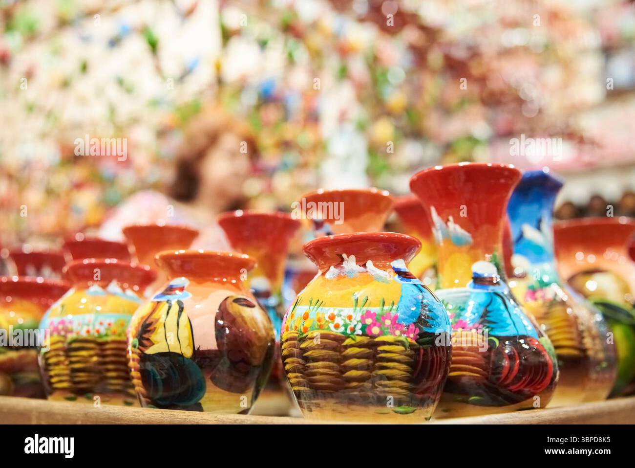 Sale of handmade ceramic vases painted with colorful traditional scenes ...