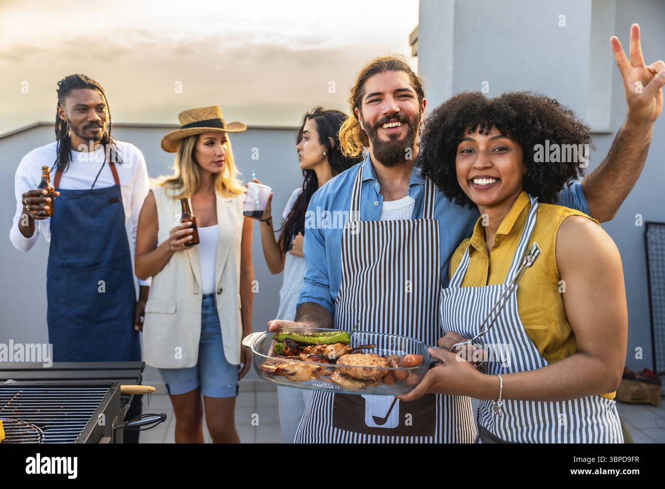 Chefs celebrating with friends on a rooftop, grilling delicious food ...