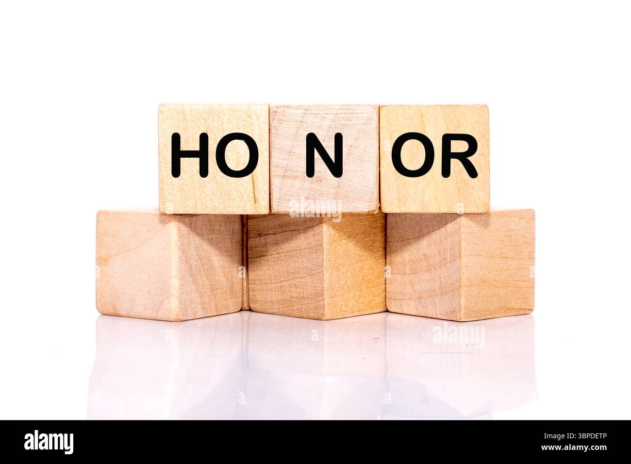 The HONOR concept word is assembled from wooden cubes. ethics, respect ...