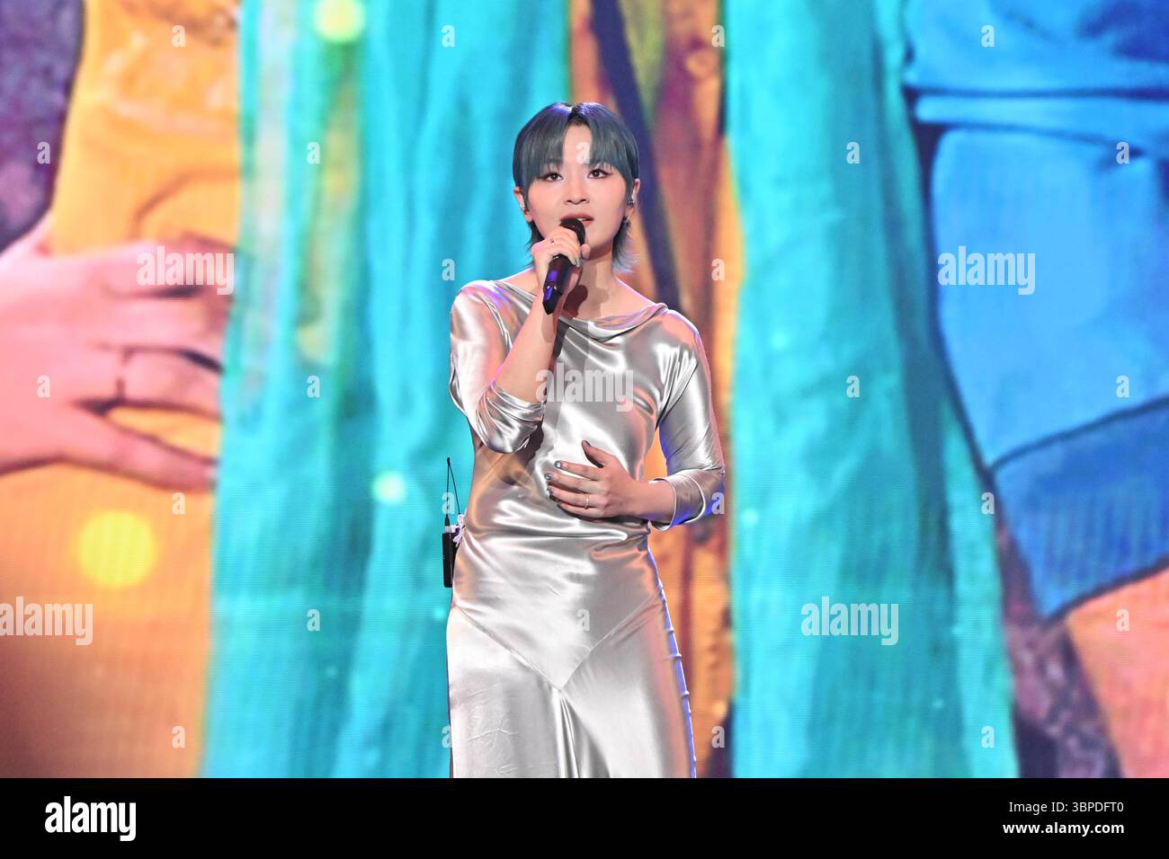 Chinese singer, songwriter, and actress Bibi Zhou attends an activity ...