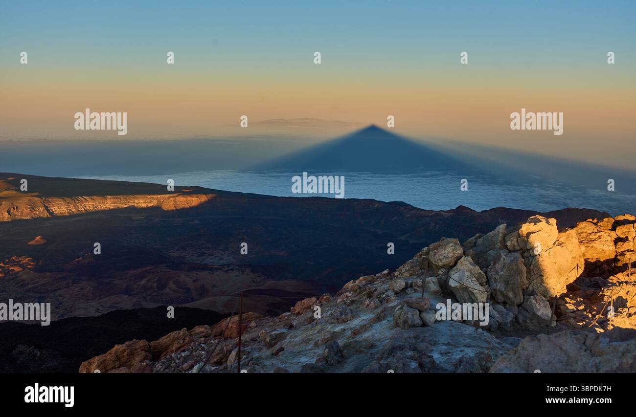 Sunset view from Pico del Teide with its iconic triangular shadow cast ...