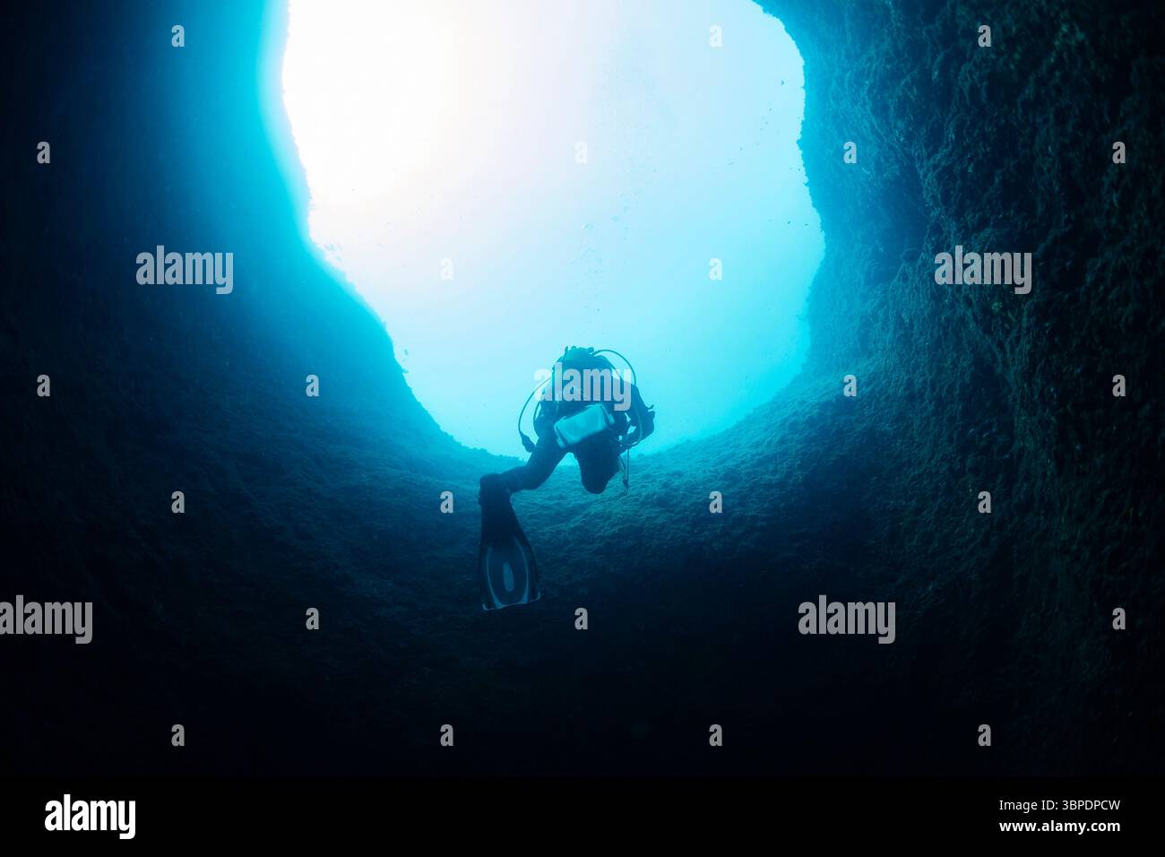 diver coming out of an underwater cave Stock Photo - Alamy