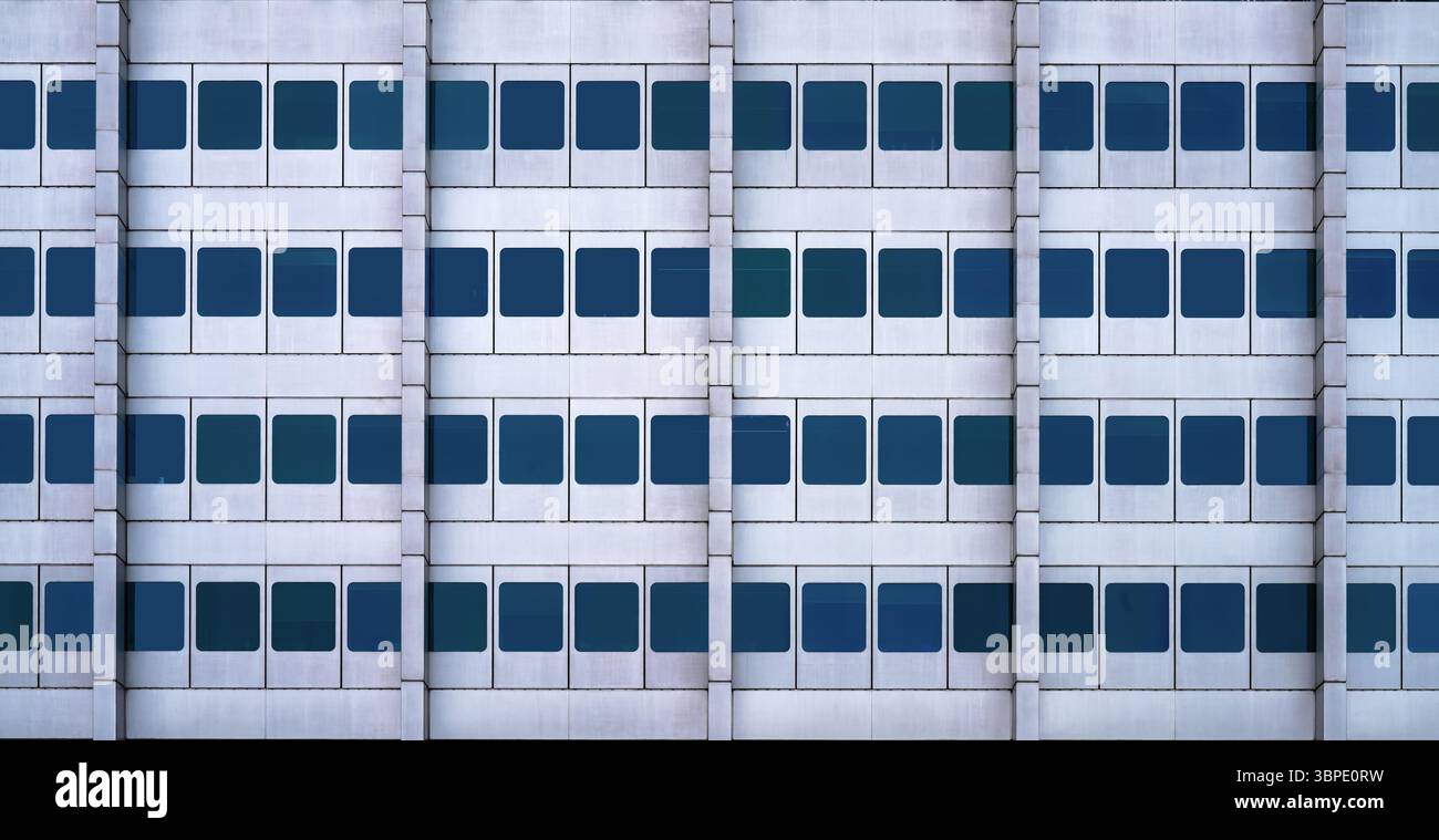 Modern office building with curtain wall glass facade and concrete core, showcasing contemporary ...