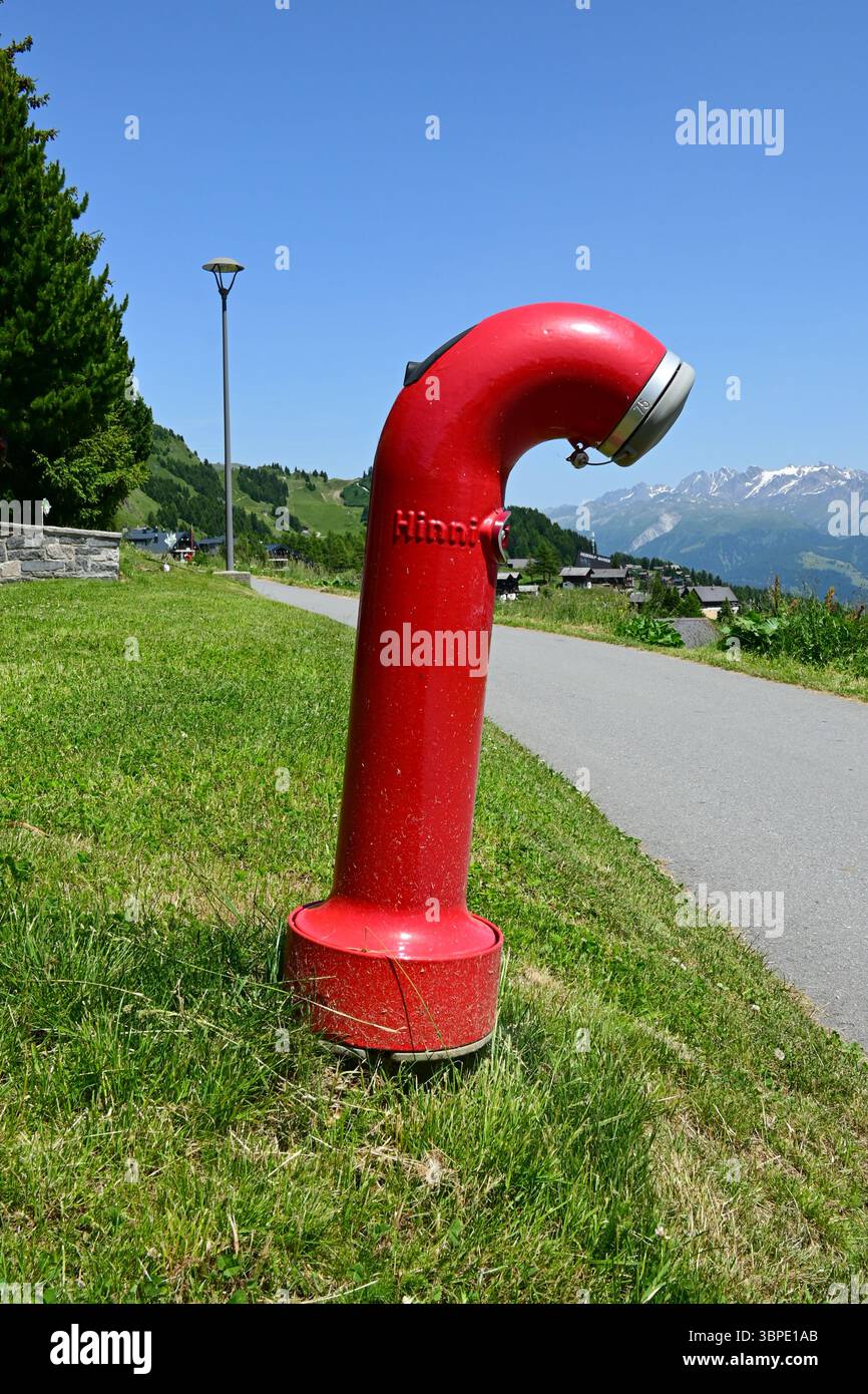 Bright red fire hydrant in the Swiss Alps near Riederalp, Valais ...
