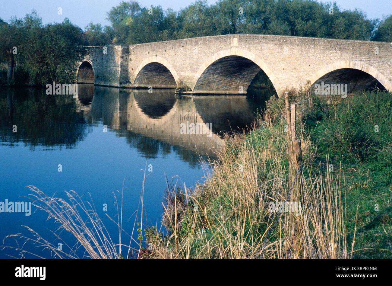 Historic arched stone bridge built 1807, River Thames, Sutton Bridge ...