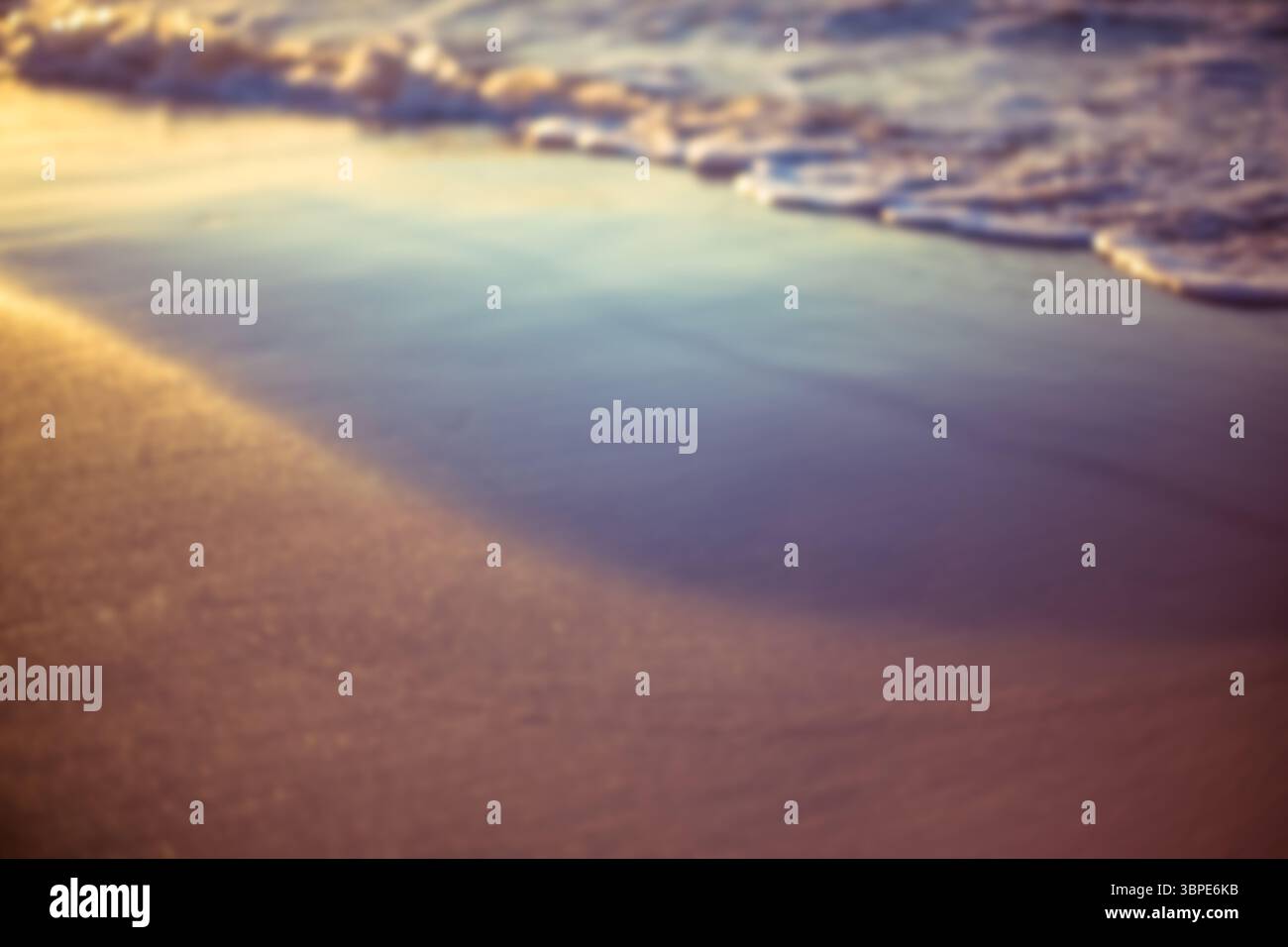 Beach shore waves sunset sand hi-res stock photography and images - Alamy
