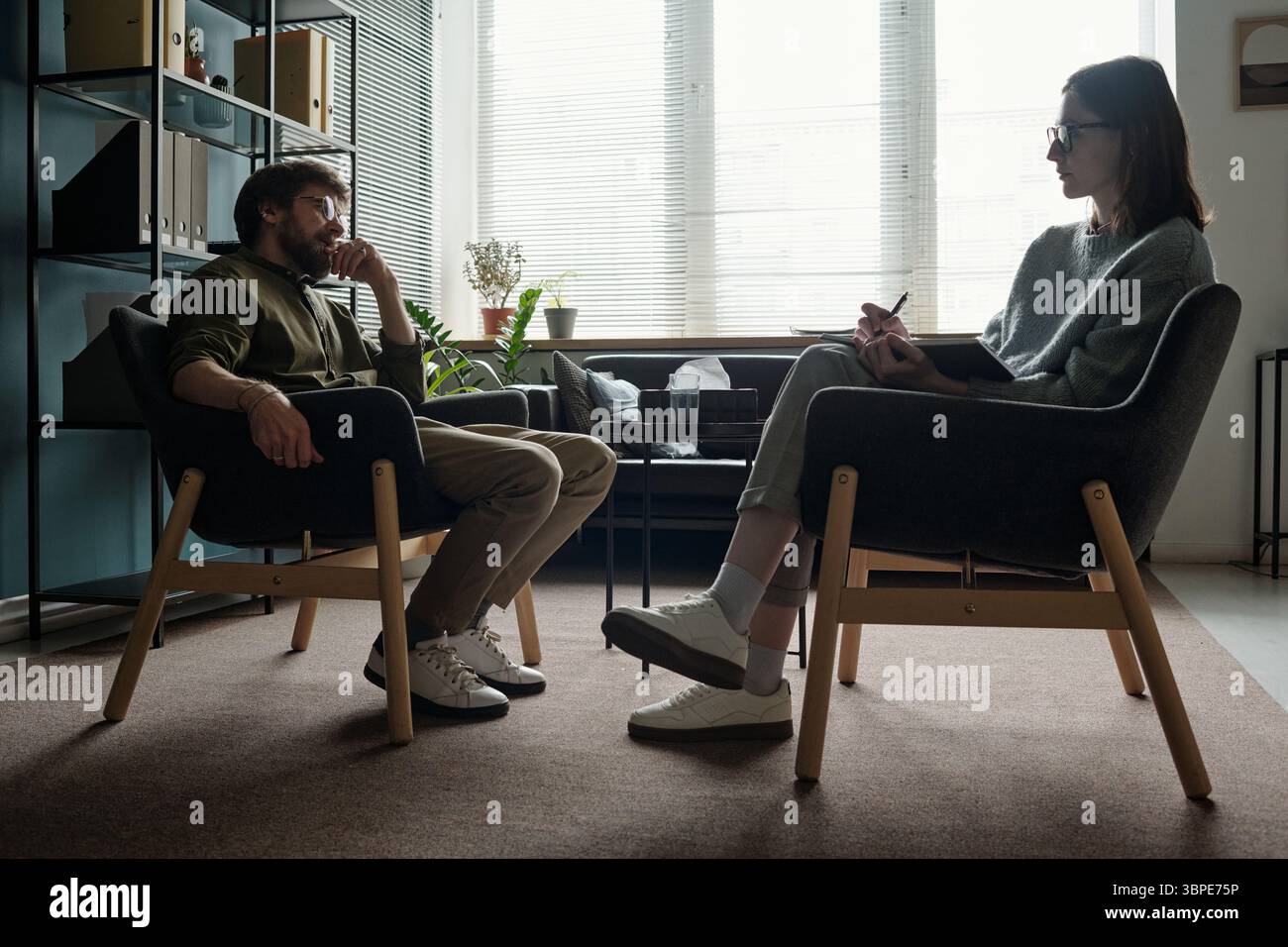 Woman during psychotherapy session hi-res stock photography and images ...