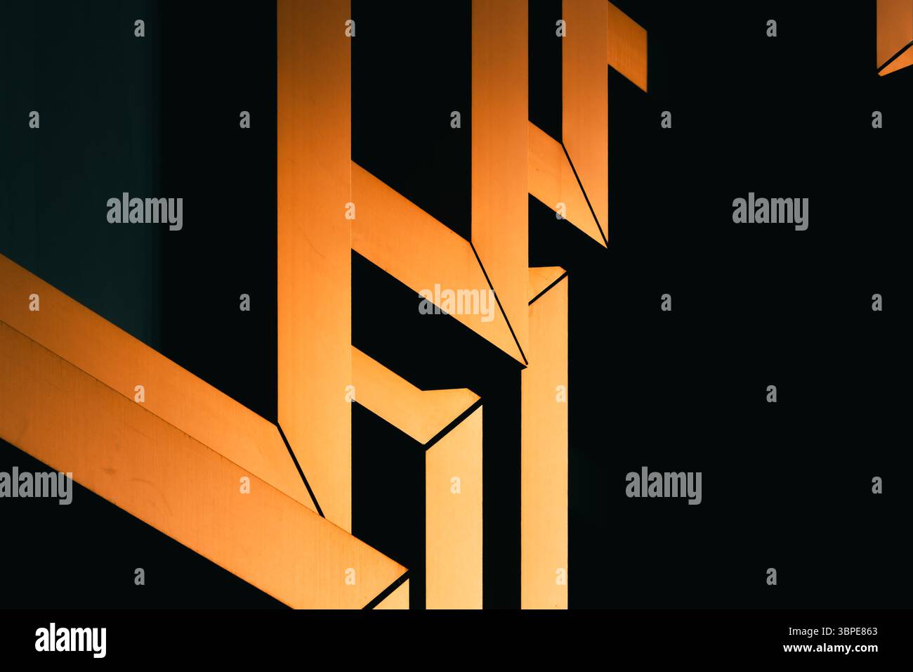 Close-up of modern architectural detail with interlocking orange metal ...