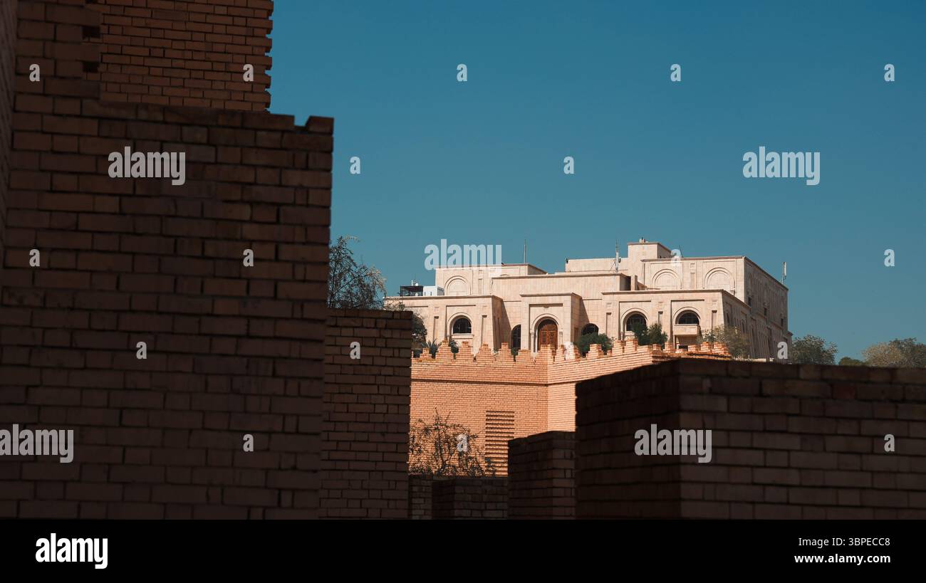 Visitors admire the impressive facade of Saddam Hussein Palace in Iraq ...