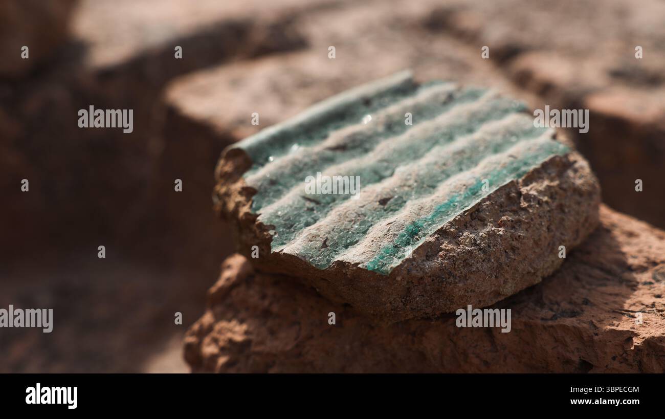 A unique green stone artifact, featuring intricate engravings ...
