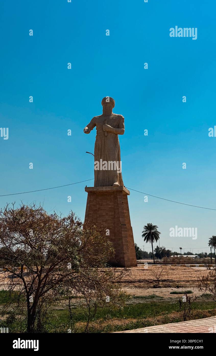 A towering statue of a notable figure rises amidst a clear blue sky in ...