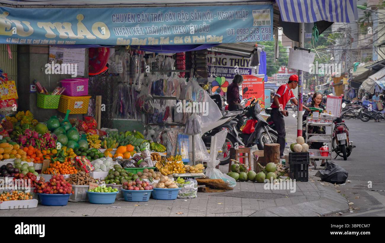 Colorful street market with tropical fruits and vendors in Nha Trang ...