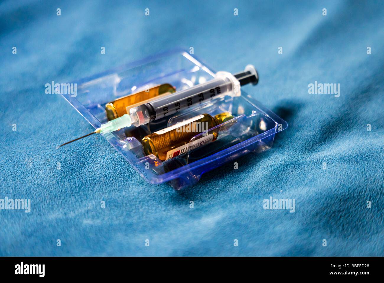 single-use medical syringe with empty drug bottle indoors Stock Photo ...