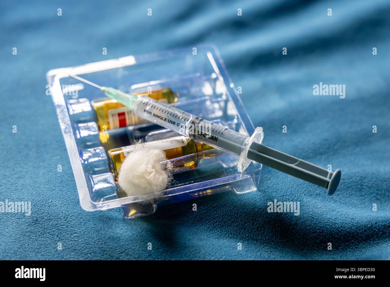 used injection and empty medicine vial in clinical setting Stock Photo ...