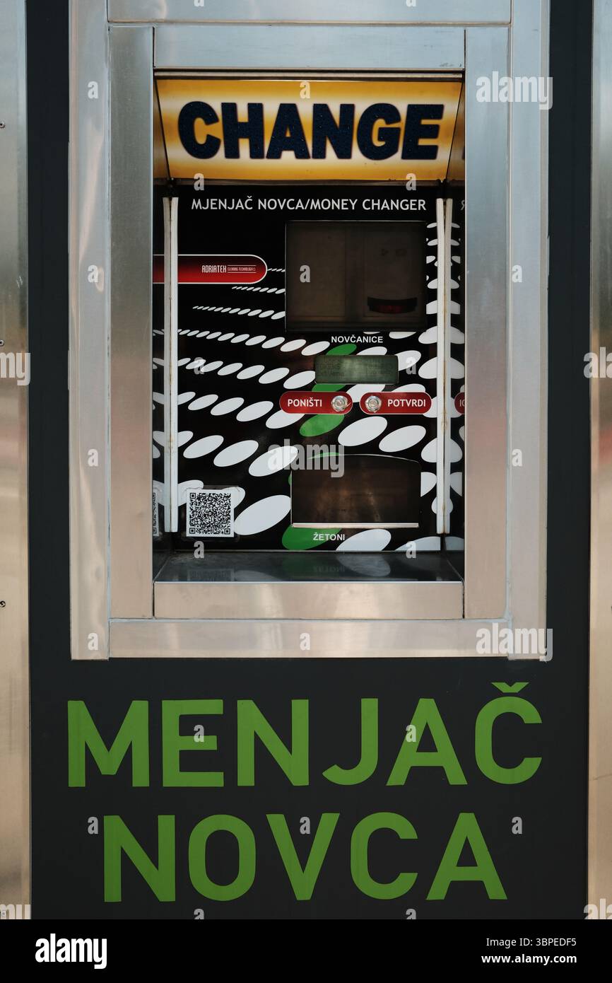 Automated self-service money changer machine with CHANGE label and currency exchange functions ...