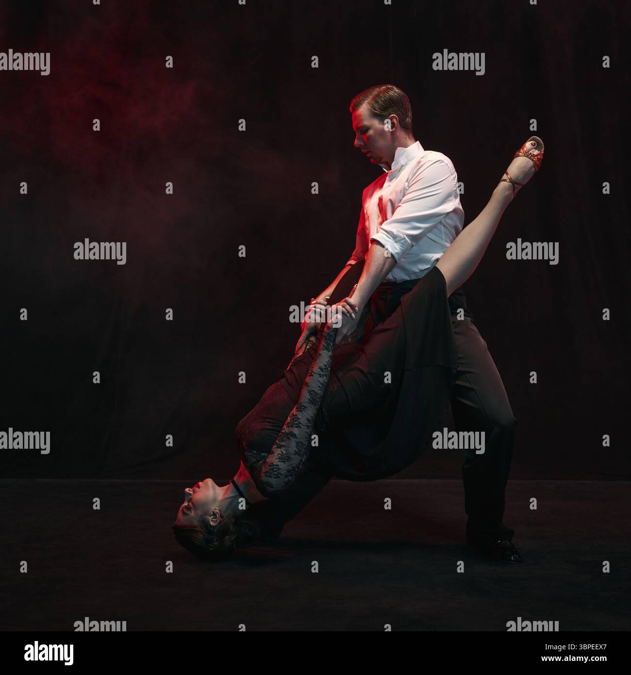 Passionate dancers striking dramatic pose capturing essence of ...