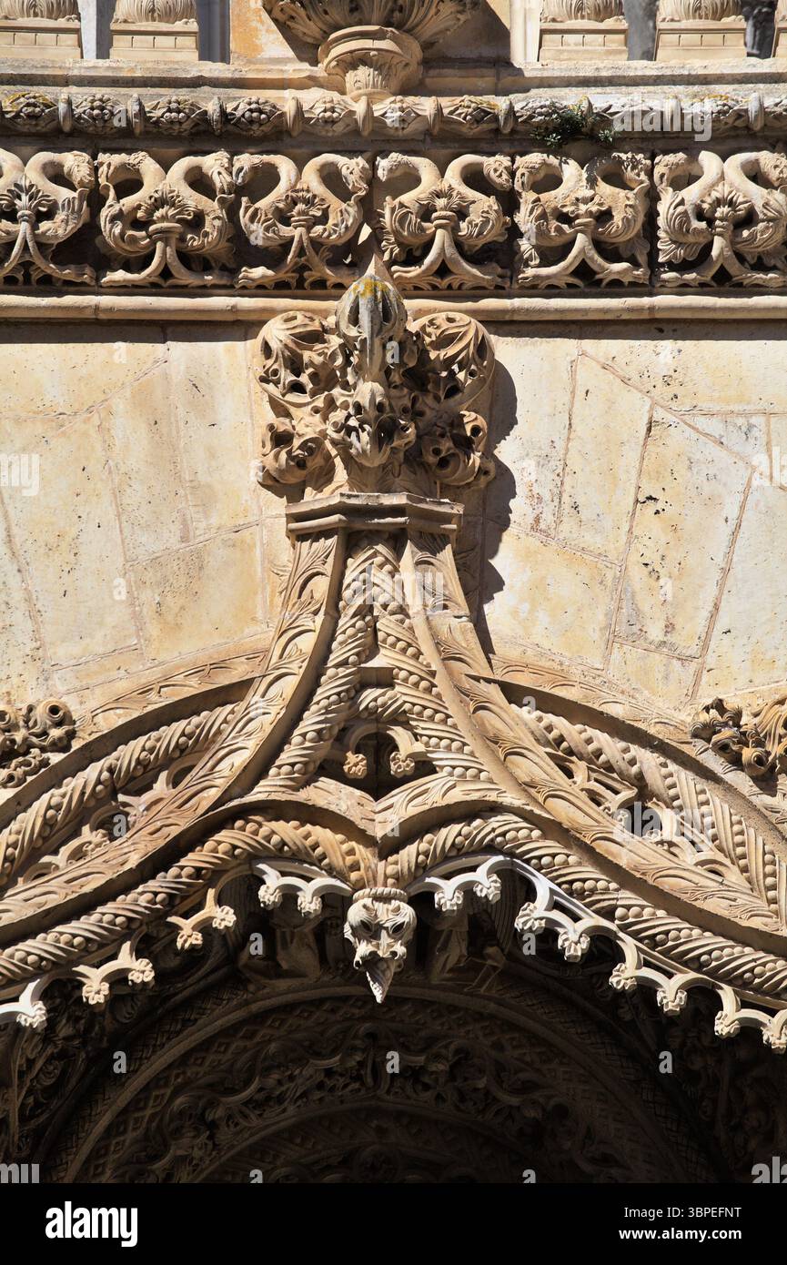 Detailed stone archway displays intricate patterns at Batalha monastery ...