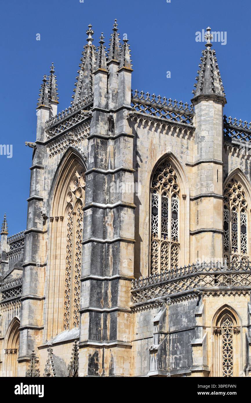 Batalha monastery showcases detailed gothic architecture under a clear ...