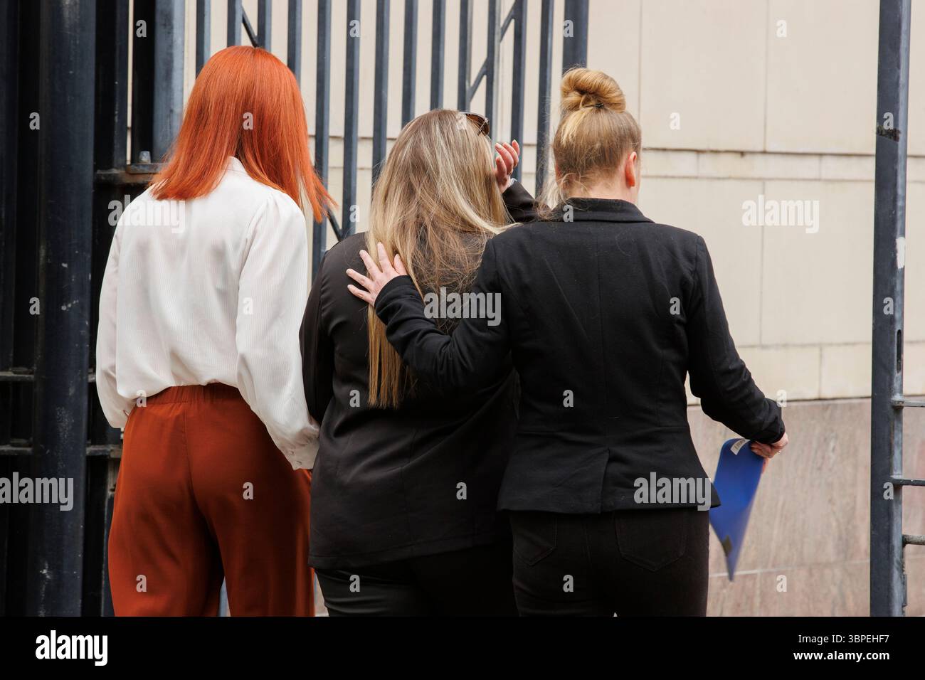 Paul Rowlands' sister Cheryl Burns (right) comforts her niece Leanne ...