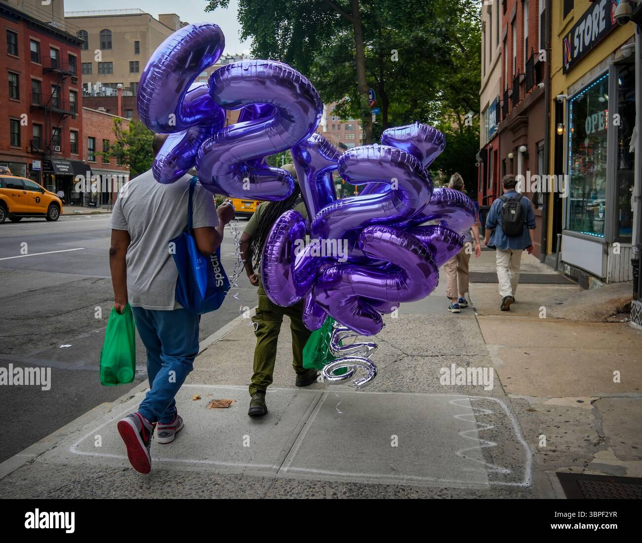 Graduation celebration balloons in the Chelsea neighborhood of New York ...