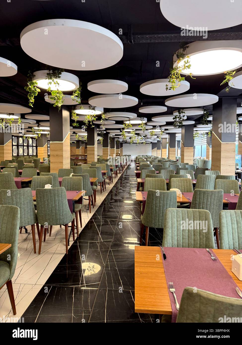 Stylish dining hall in resort all-inclusive restaurant. Tables with ...