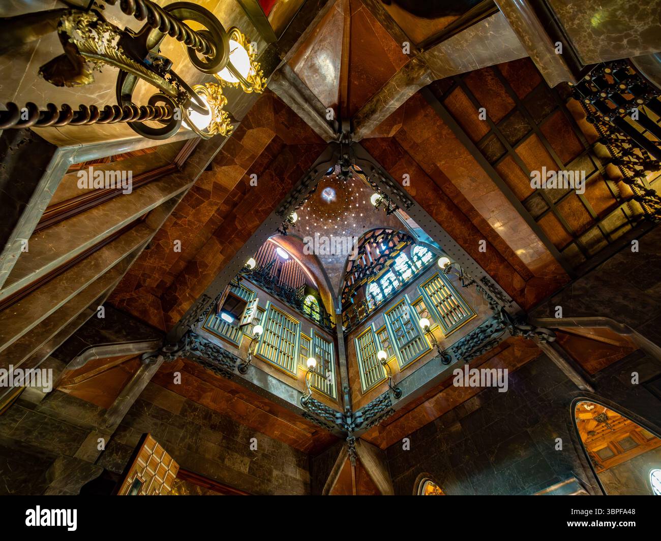 Dramatic low angle view of the soaring central hall and perforated dome ...