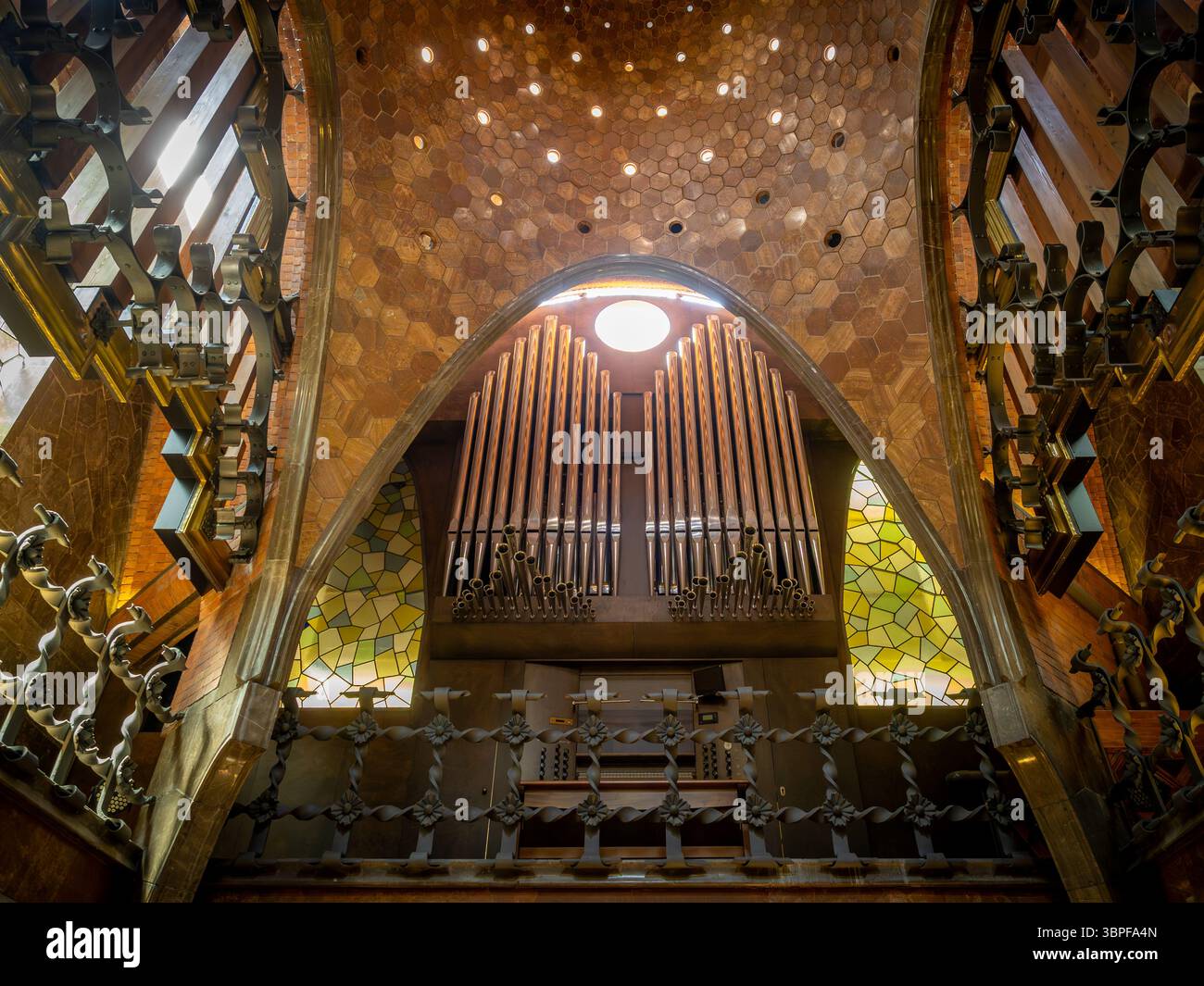 The pipes of the grand organ are seen through a parabolic arch in the ...