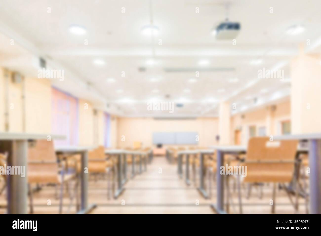 Abstract blur interior of empty University audiences. Modern school classroom on light defocus ...