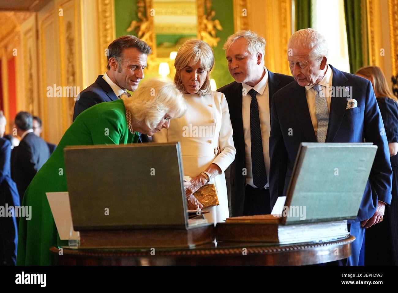 King Charles III (right) and Queen Camilla (left) with the President of ...