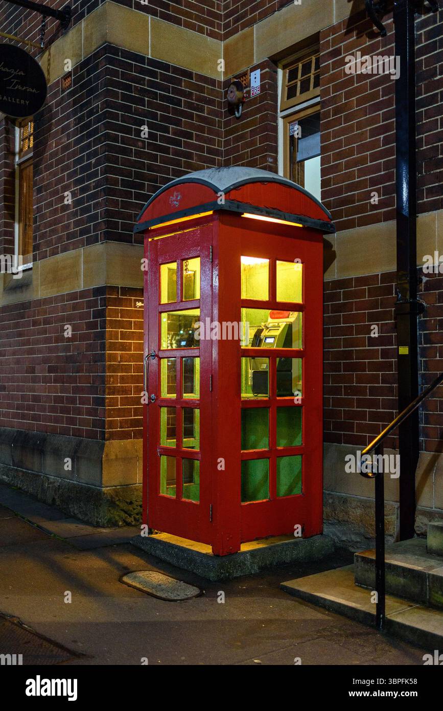 An old phone booth on George Street in Sydney at night Stock Photo - Alamy