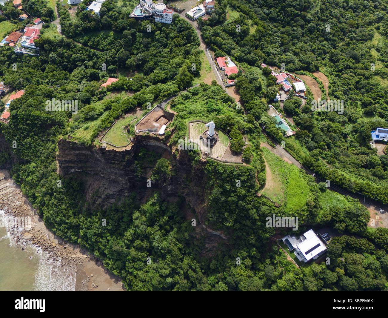 Green cliff with jesus christ statue above top drone view Stock Photo ...