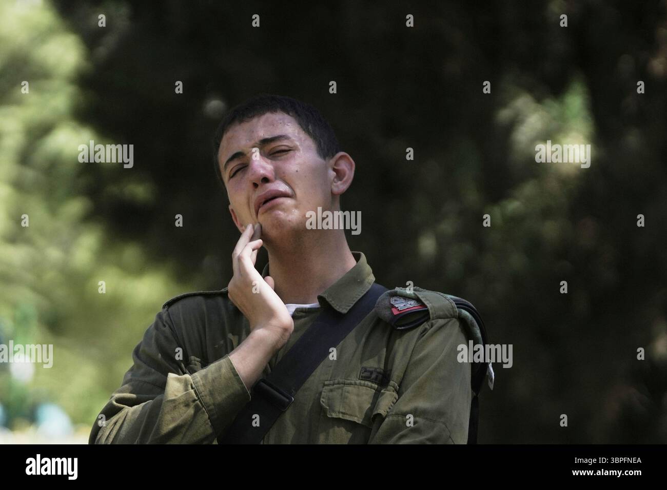 A soldier weeps at the funeral for Israeli Defense Forces Staff Sgt ...