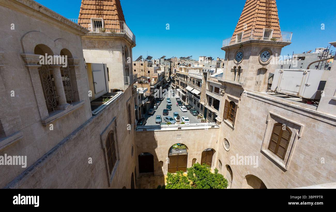 Aerial view of a historic city street flanked by old stone buildings ...