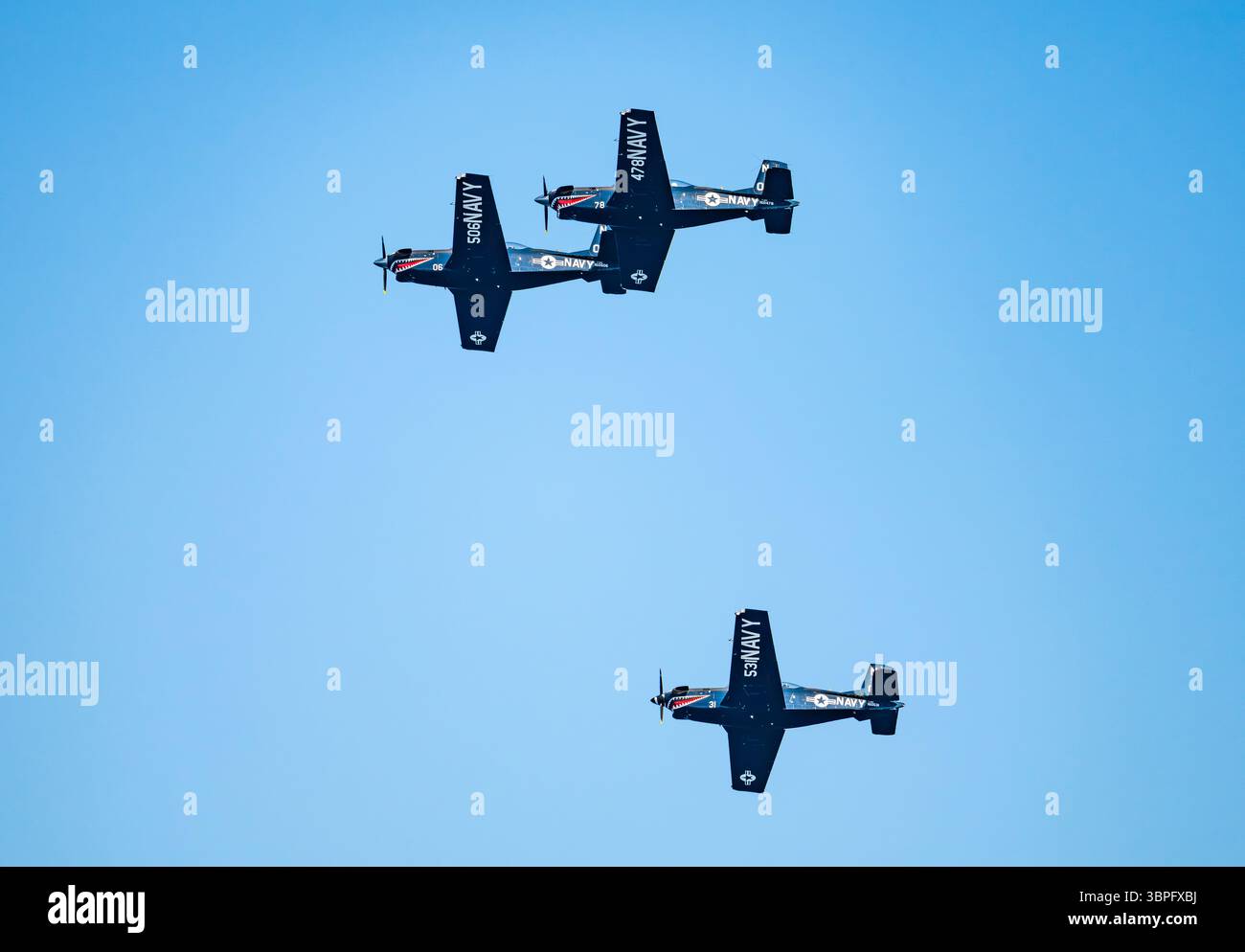 Three Beechcraft T-34C Turbo Mentor airplanes painted as a mean shark ...