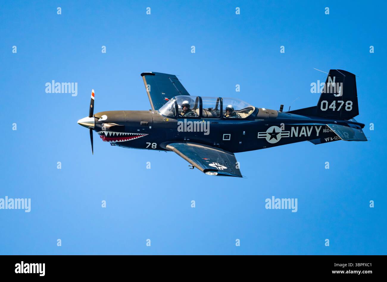 A Beechcraft T-34C Turbo Mentor airplane painted as a mean shark flying ...