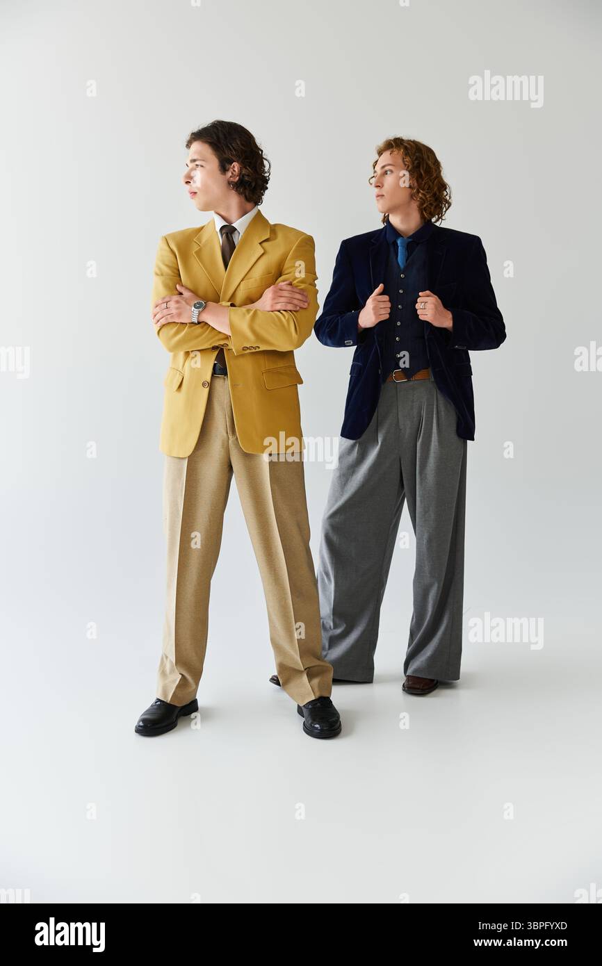 Two young men confidently pose together, highlighting their unique ...