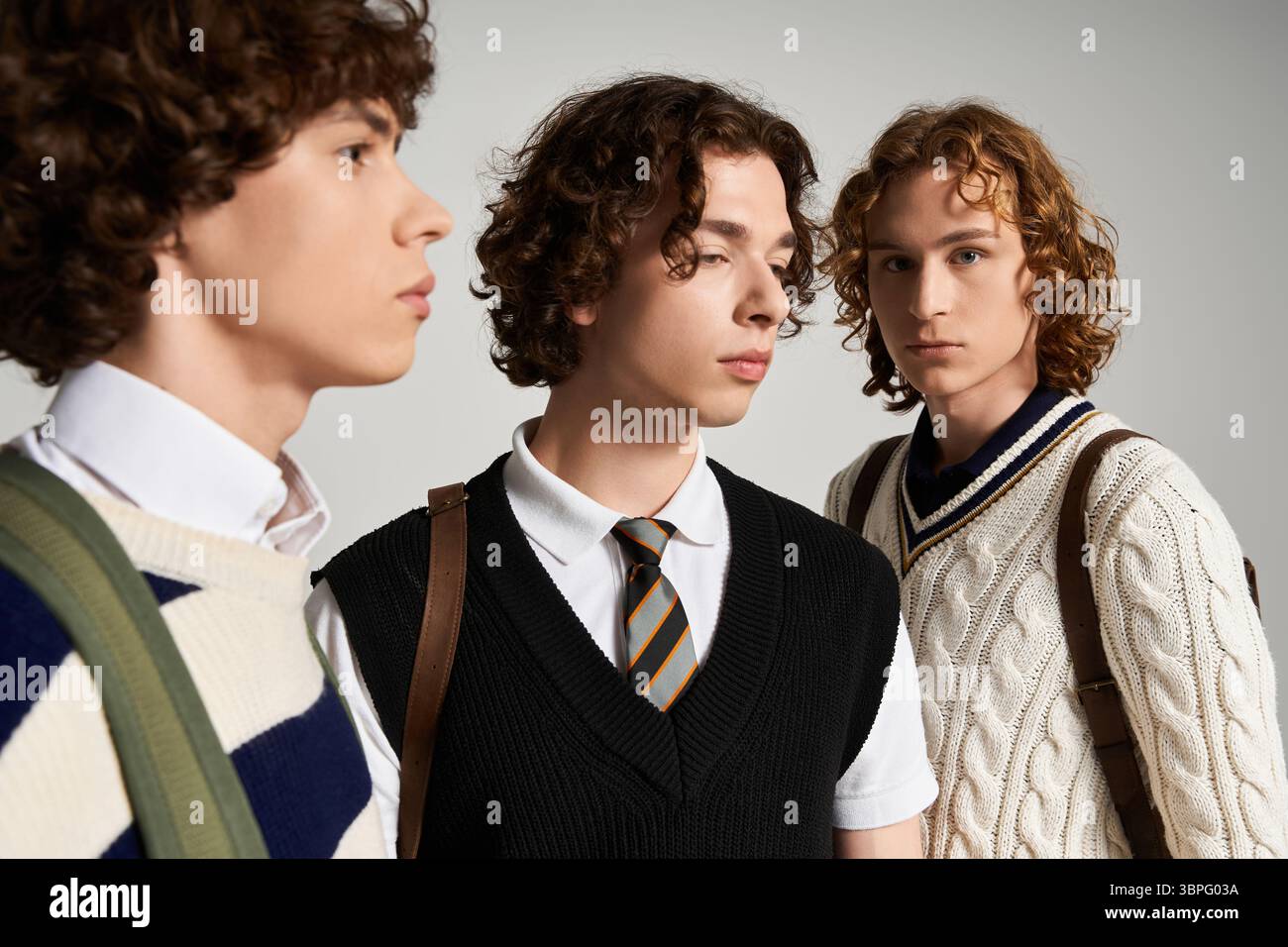 Three stylish young men pose confidently, each displaying their unique ...