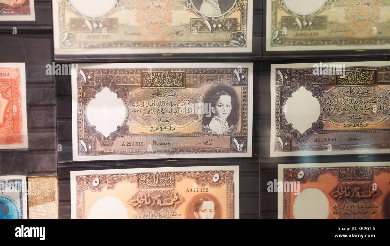 Detailed showcase of Iraqi currency at Hilla Museum highlighting ...